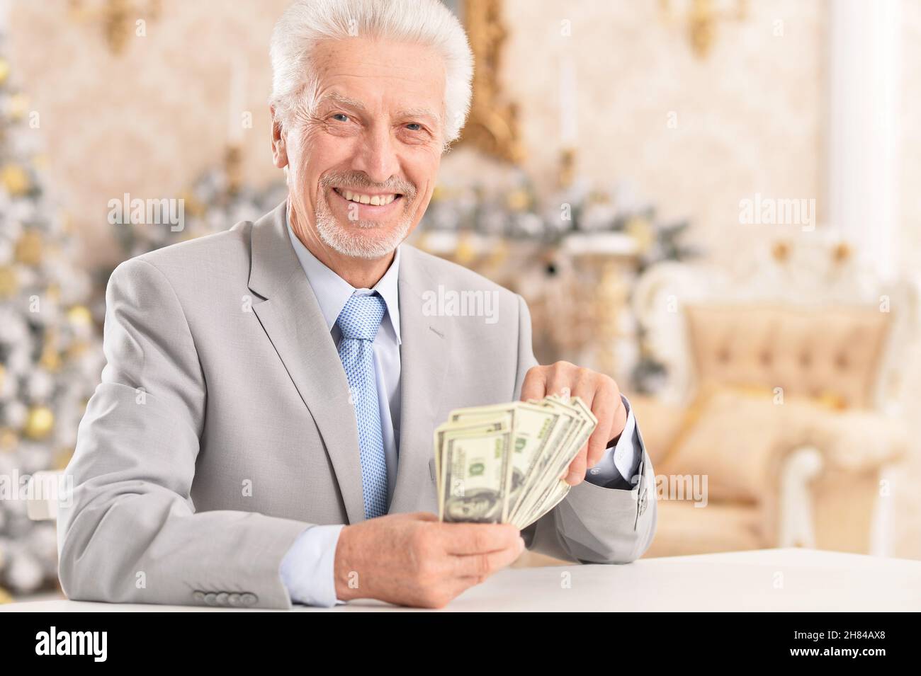 Middle aged man counting money hi-res stock photography and images - Alamy