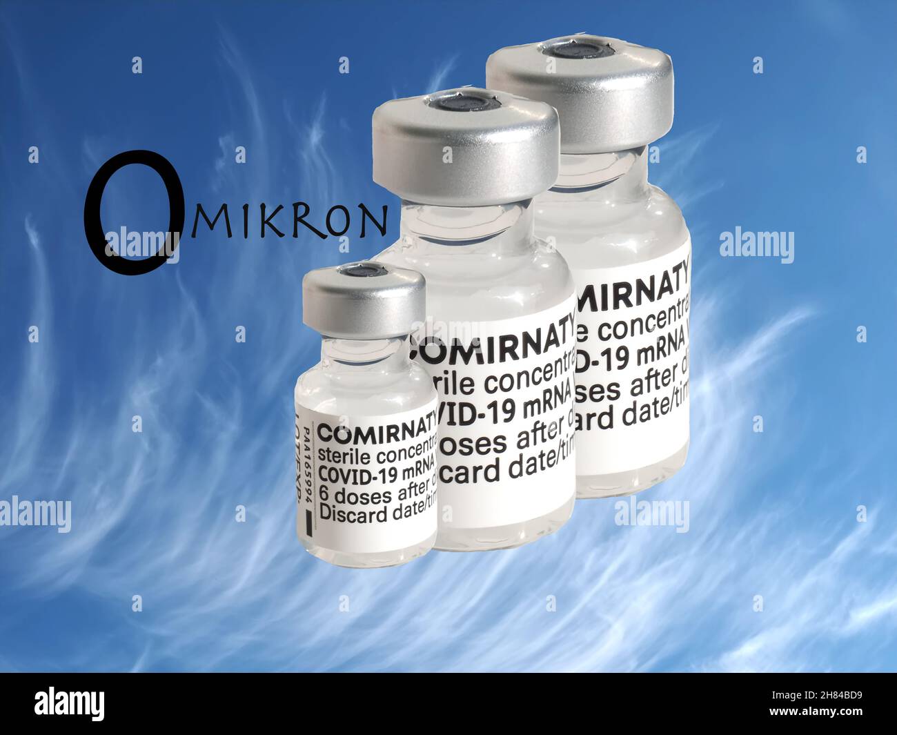 Omikron symbol on cloudy background with Biontech Fizer Vaccine Stock ...