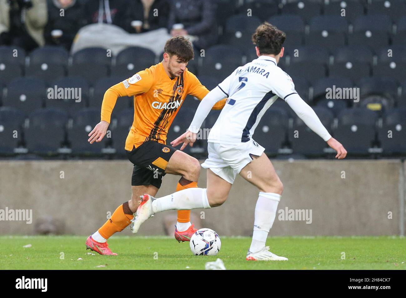 Ryan Longman #16 of Hull City runs at Dan McNamara #2 of Millwall in ...
