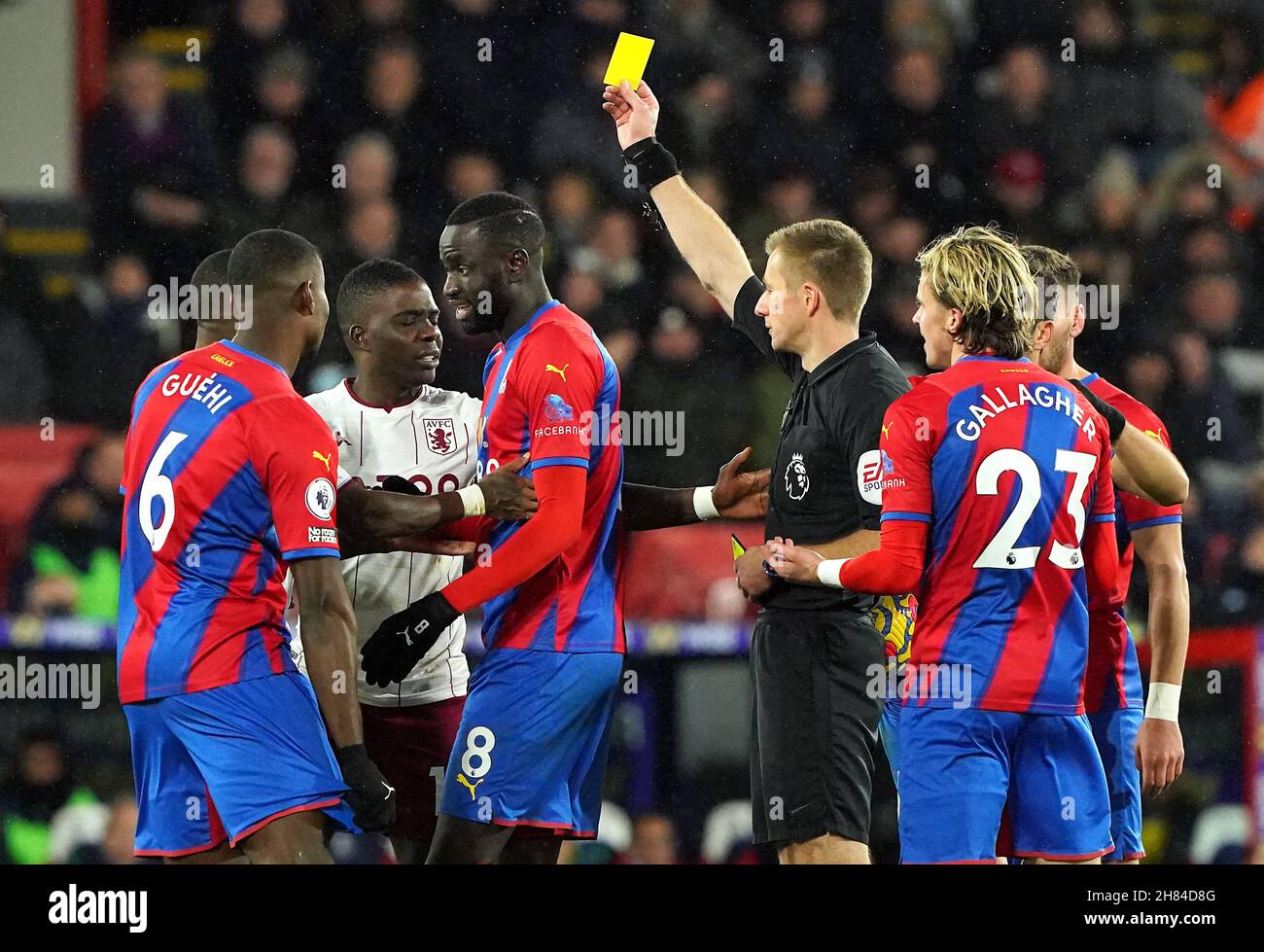 Referee Michael Salisbury shows a yellow card to Aston Villa's ...