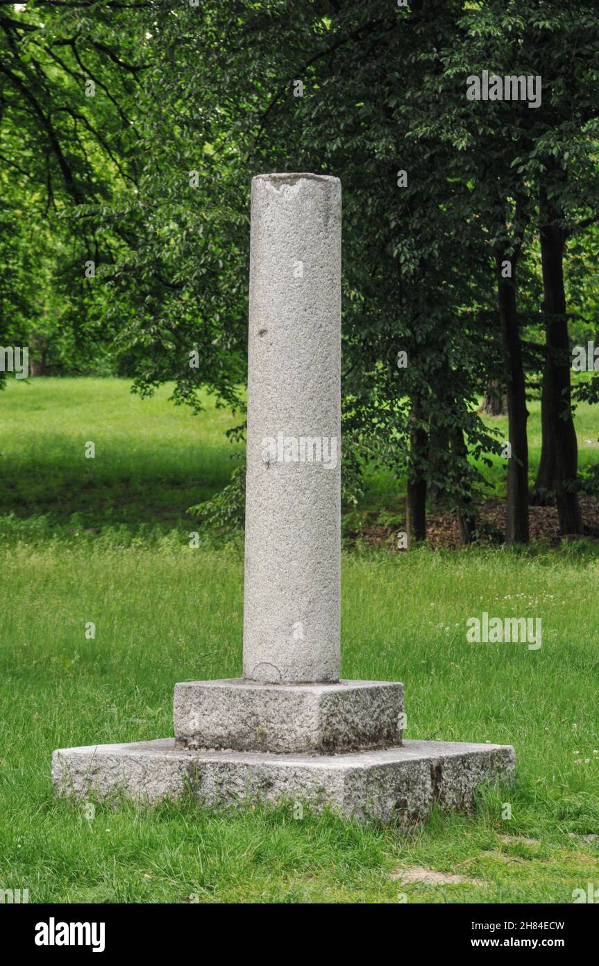 Stone obelisk in a green park Stock Photo - Alamy