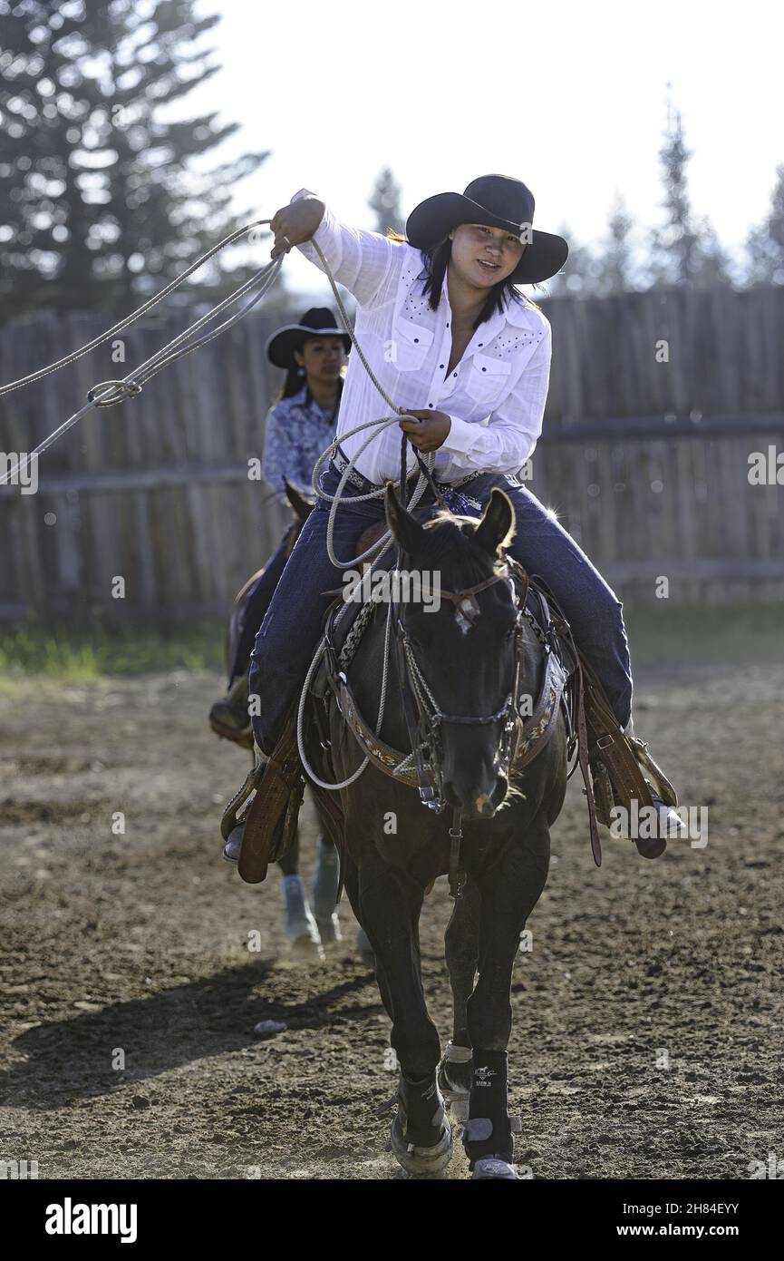 Young female roper at the Tsuu T'ina Rodeo held every July, in Bragg ...