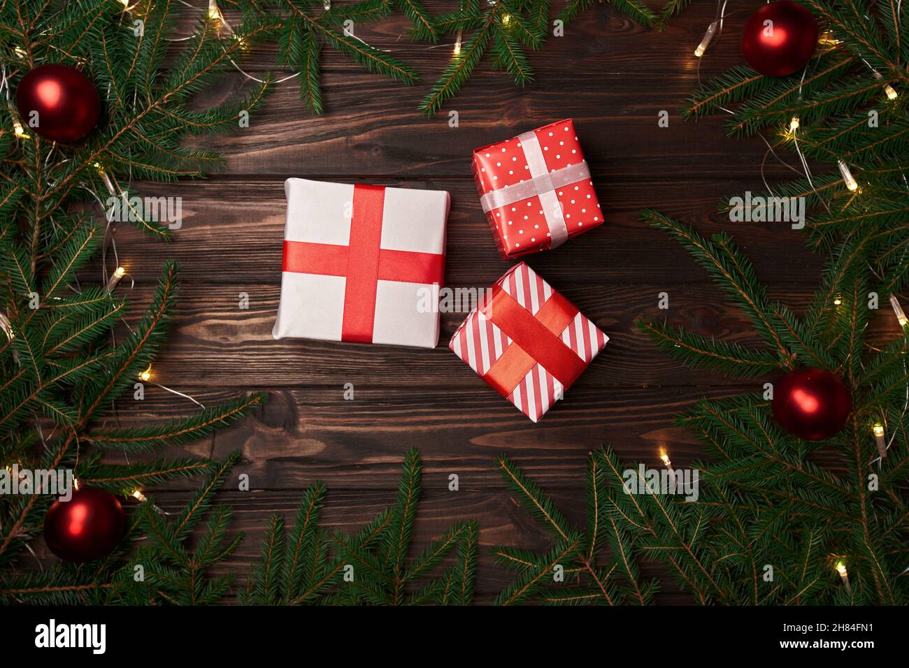 three Christmas gifts on a Christmas background Stock Photo - Alamy