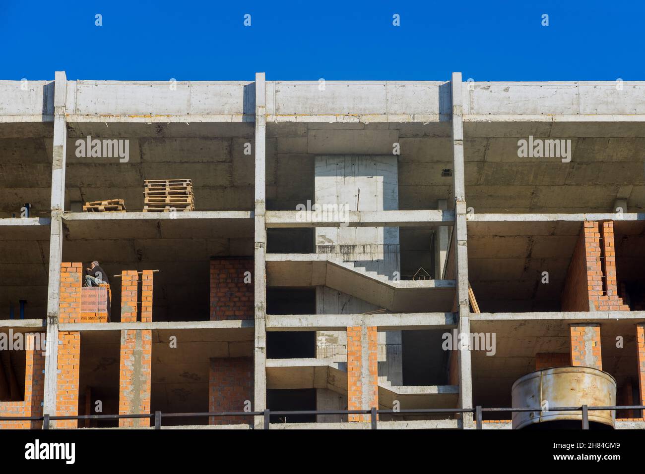 Multi-story building under construction in build progress concrete ...
