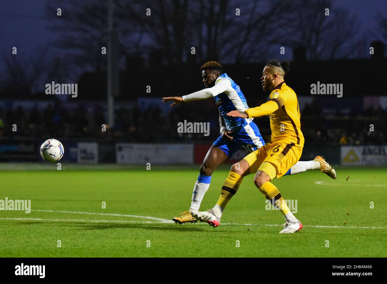SUTTON, GBR. NOV 27TH Offrande Zanzala of Barrow battles for possession ...