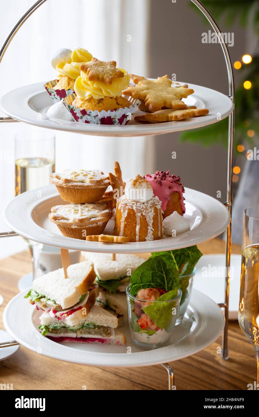 Christmas afternoon tea with mince pies, cakes, turkey sandwiches and ...