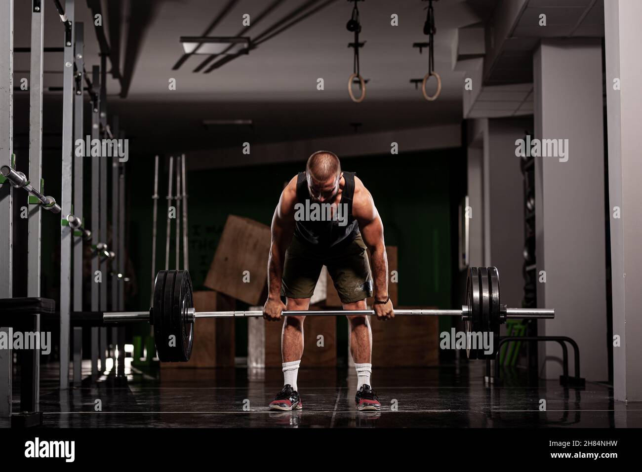 Muscular athlete lifting very heavy barbell Stock Photo - Alamy