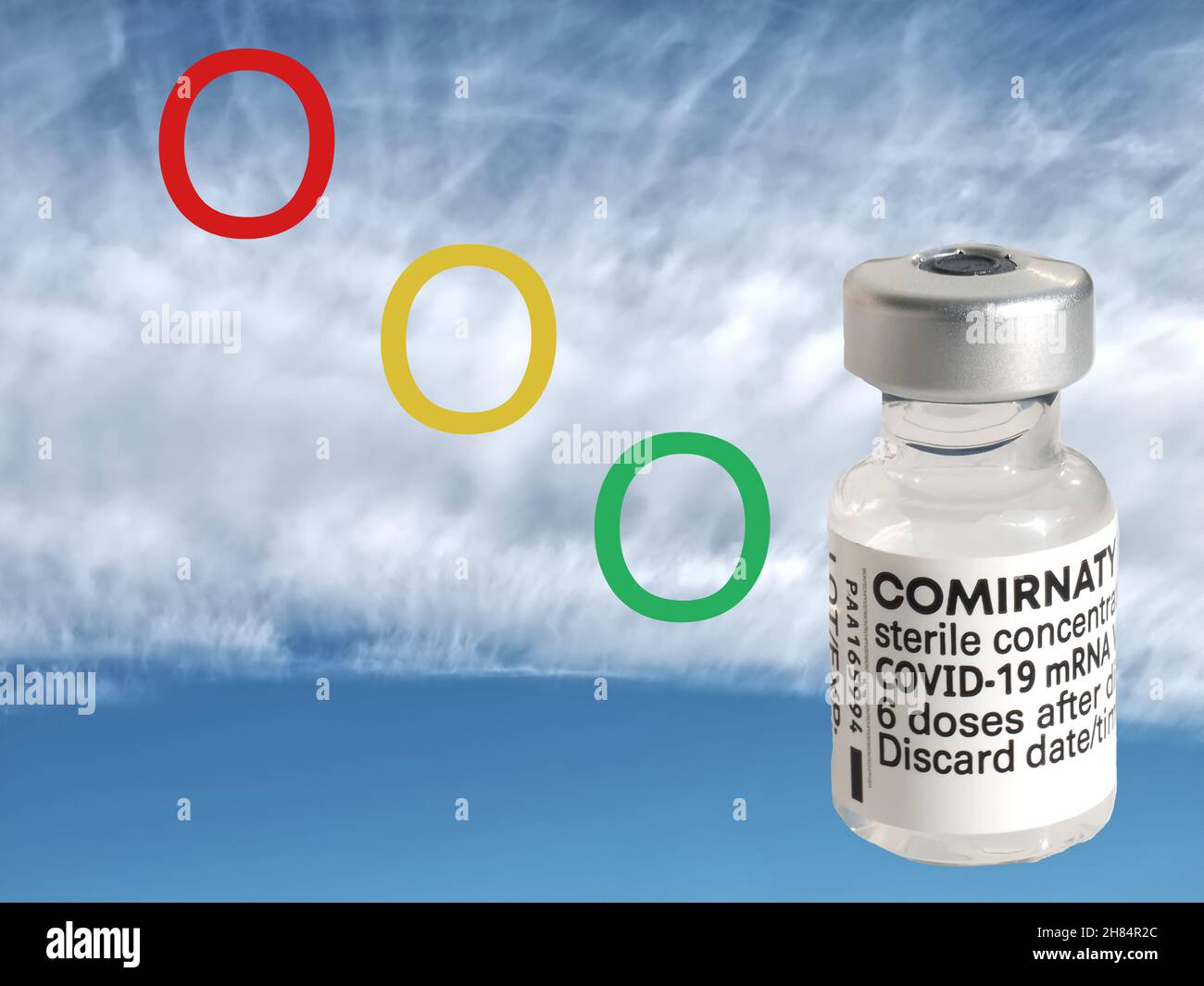 Omikron symbol on cloudy background with Biontech Fizer Vaccine Stock ...