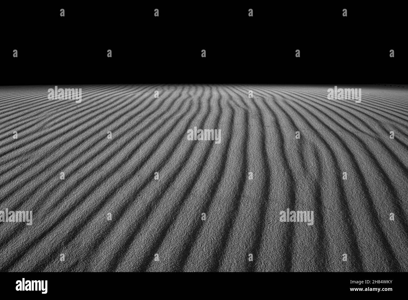 Grayscale shot of textured sand dunes on a beach Stock Photo - Alamy
