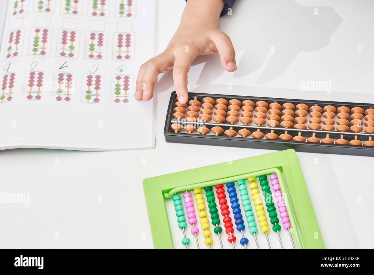 Schoolboy do mental math. Mental mathematics. 8 years old multiracial ...