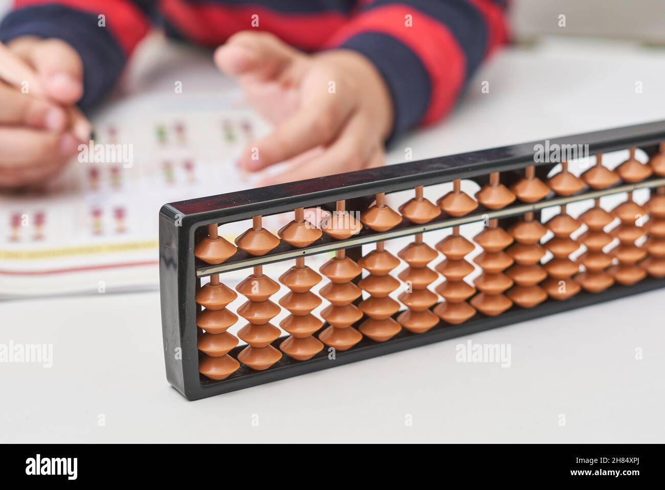 Schoolboy do mental math. Mental mathematics. 8 years old multiracial ...