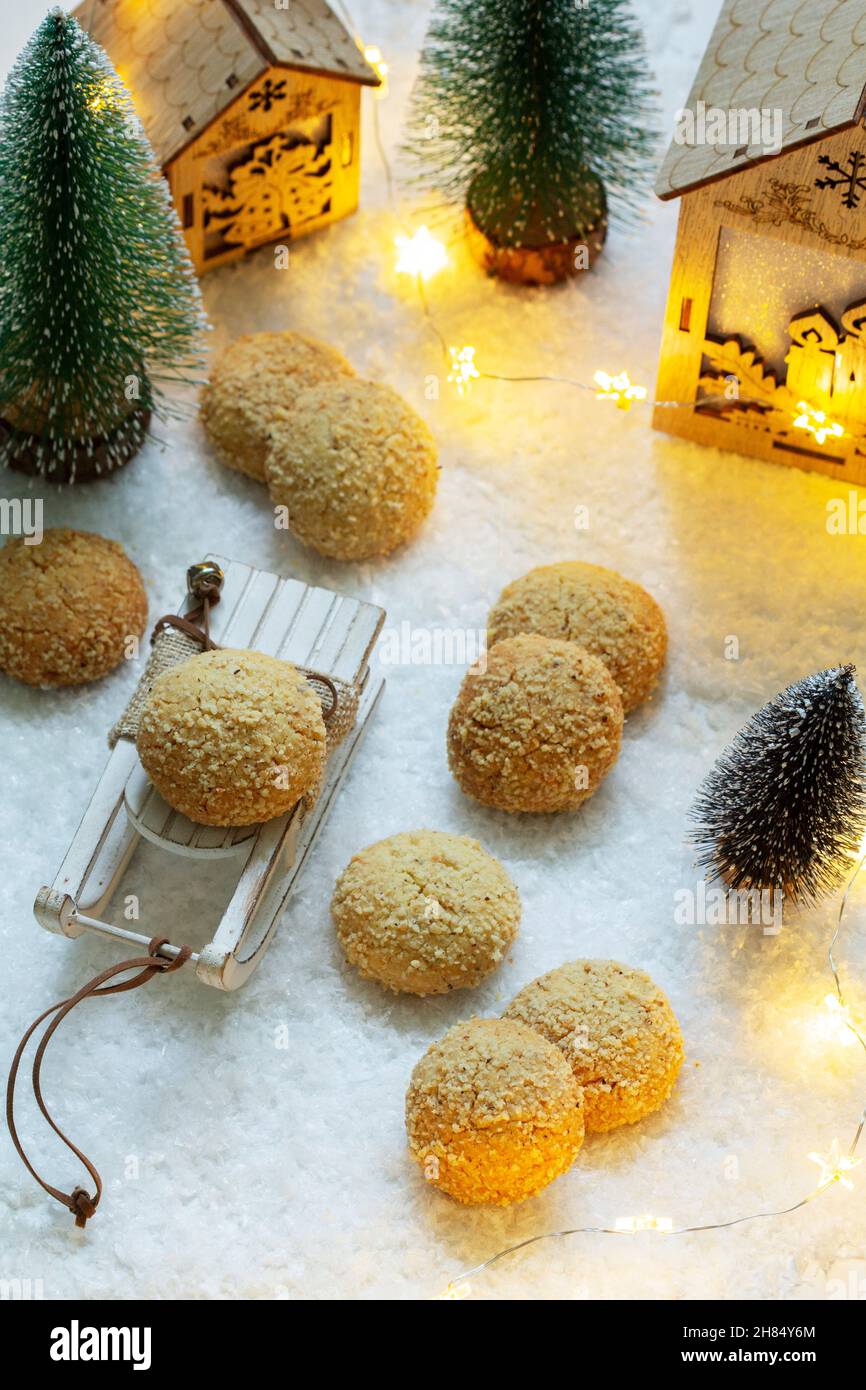 Christmas nut cookies Filbertines on a background of branches, cones ...