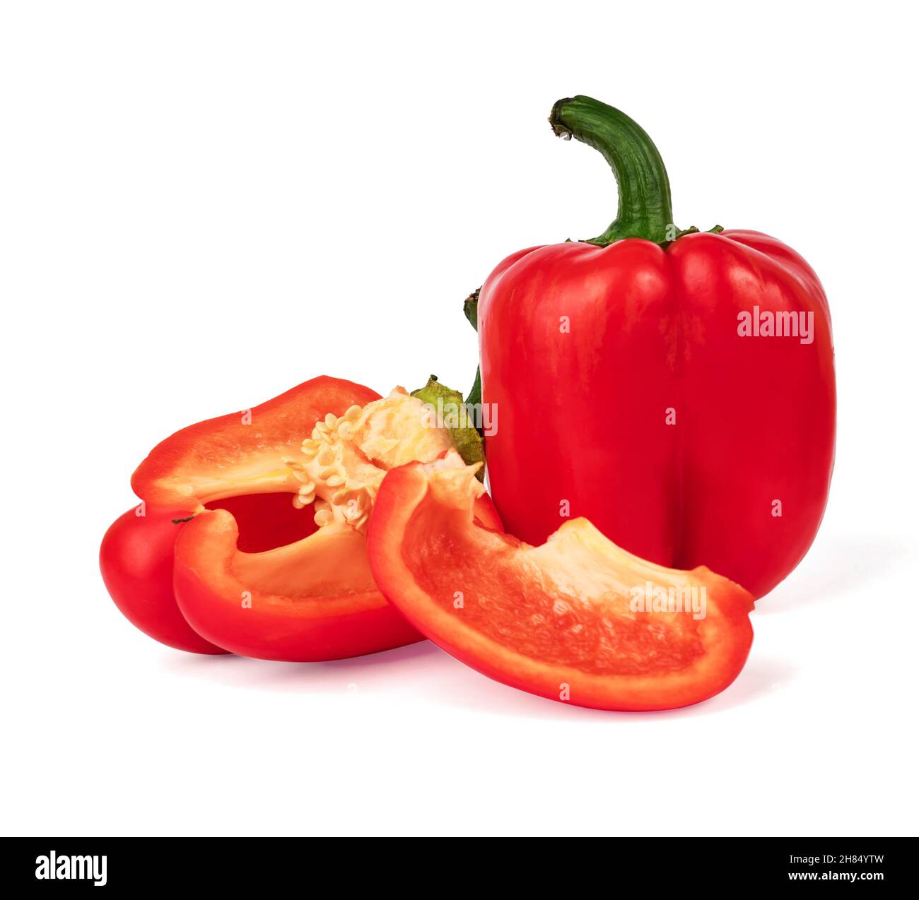 ripe bell peppers, whole and chopped into pieces, on white background ...