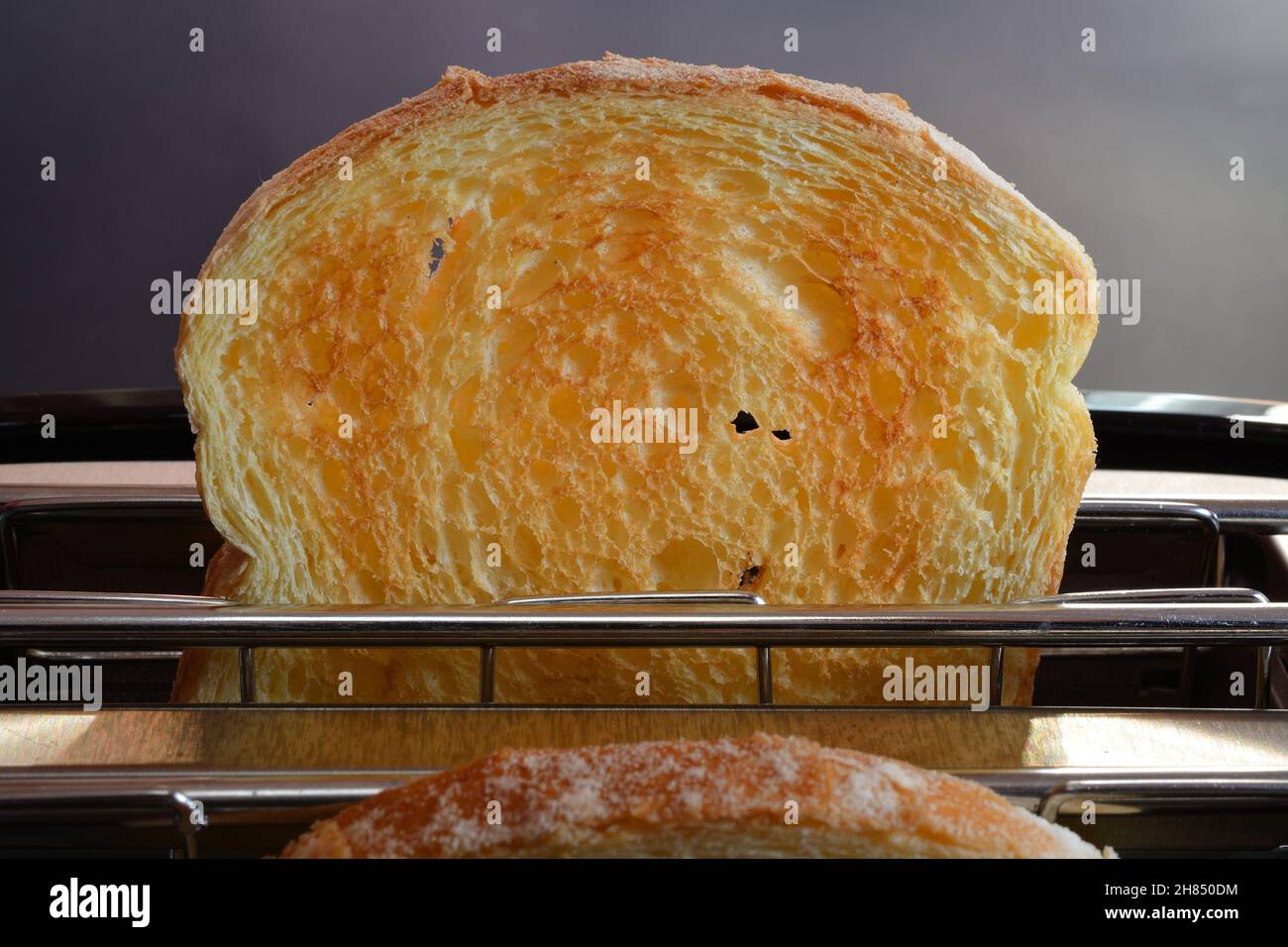 A slice of toasted bread out of the toaster Stock Photo - Alamy