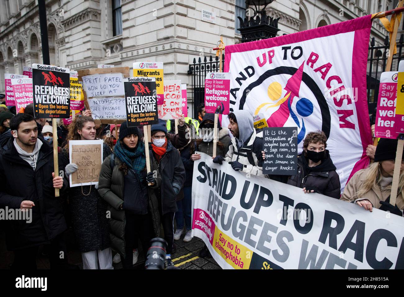 London, UK. 27th Nov, 2021. Protesters hold banners and placards during ...