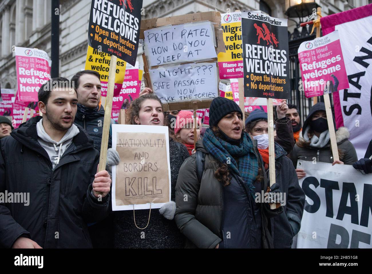 London, UK. 27th Nov, 2021. Protesters hold placards during the ...