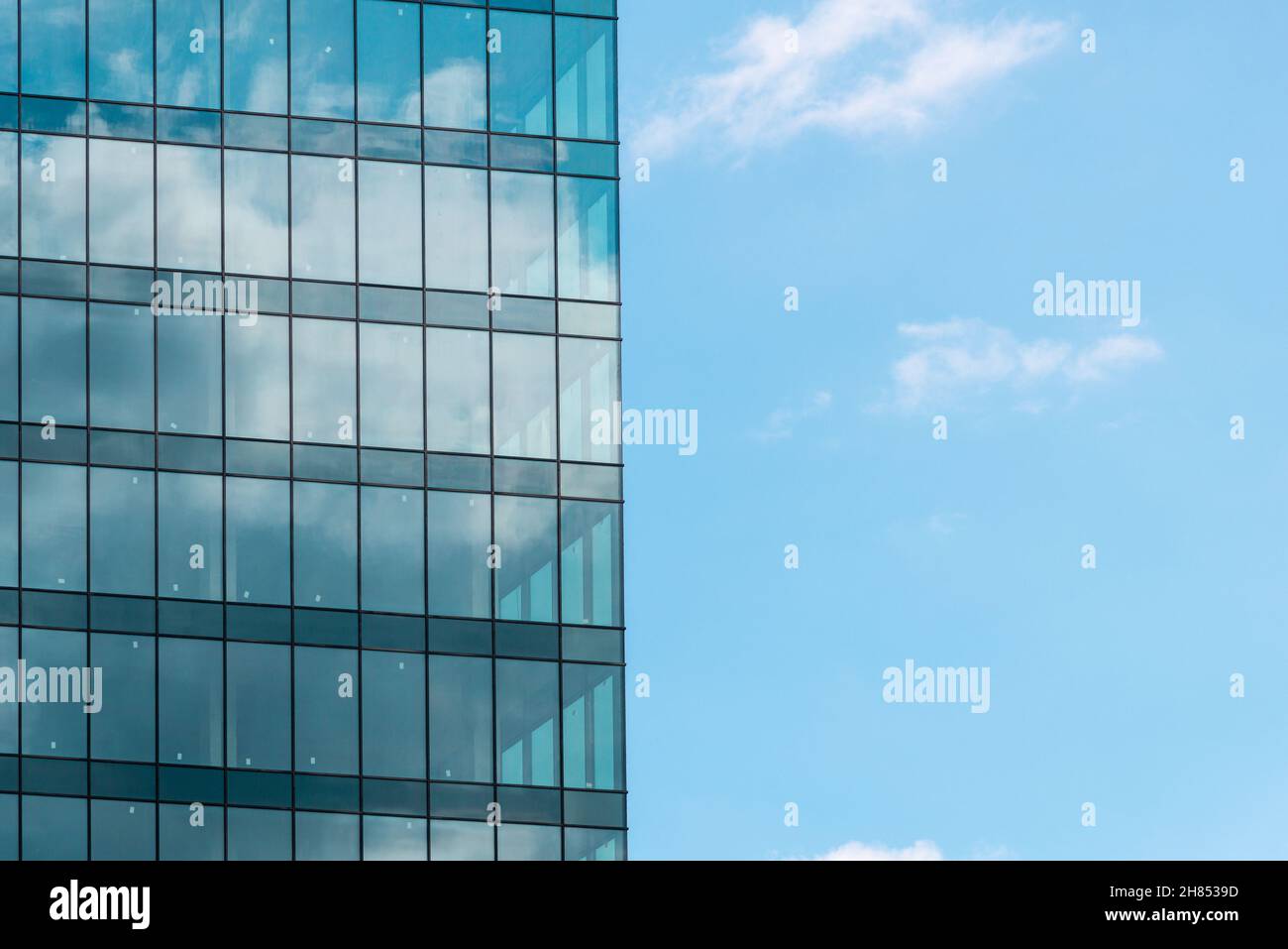 Modern skyscraper exterior, blue glass wall Stock Photo - Alamy