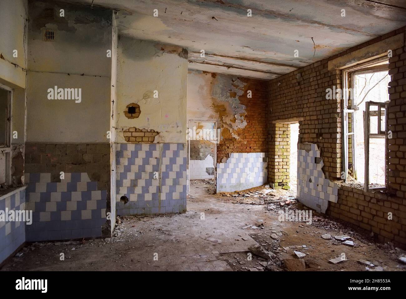 Abandoned Soviet building with tiled walls and large window horizontal ...