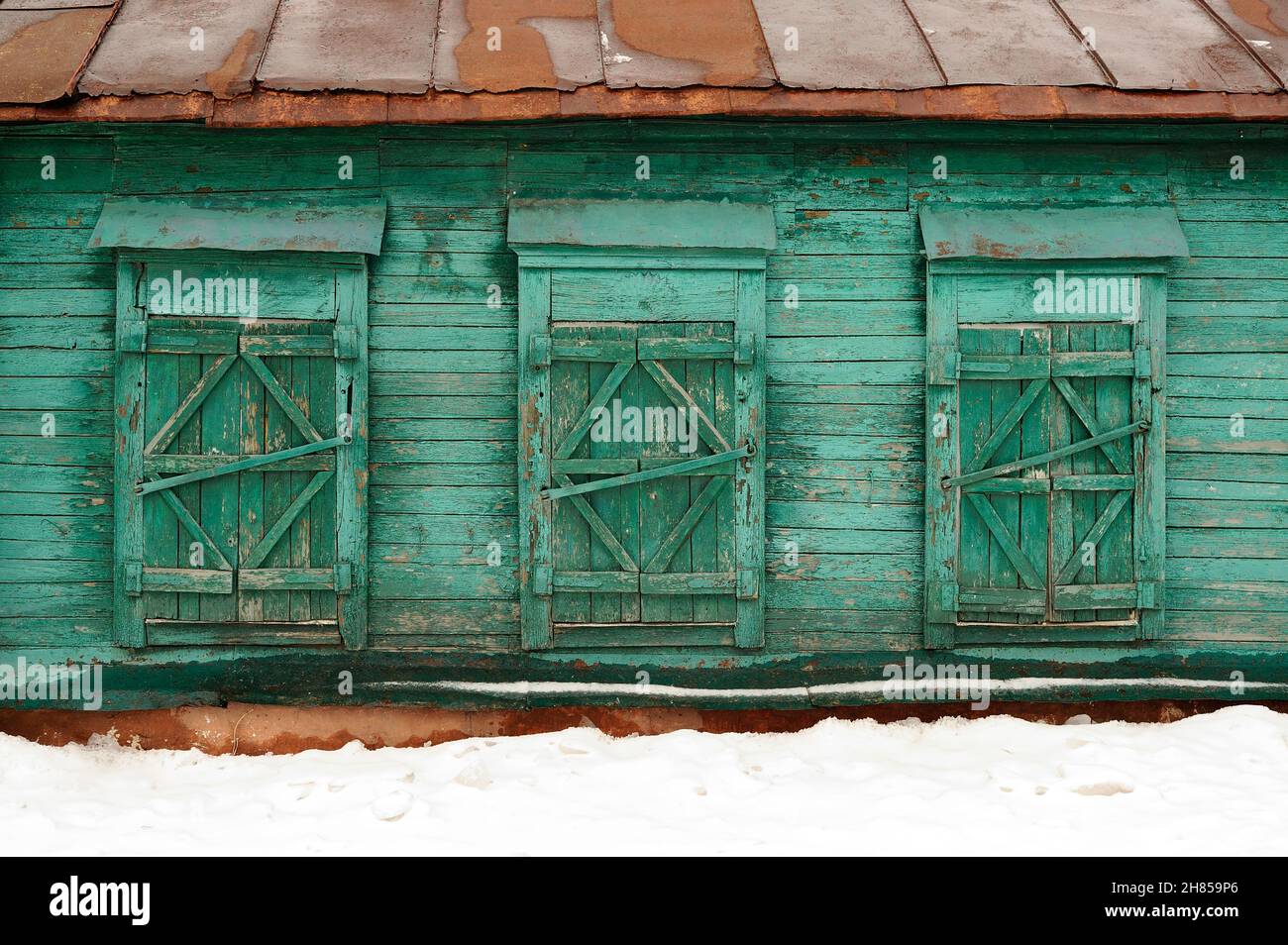 Old poor abandoned country house with three shut windows horizontal ...