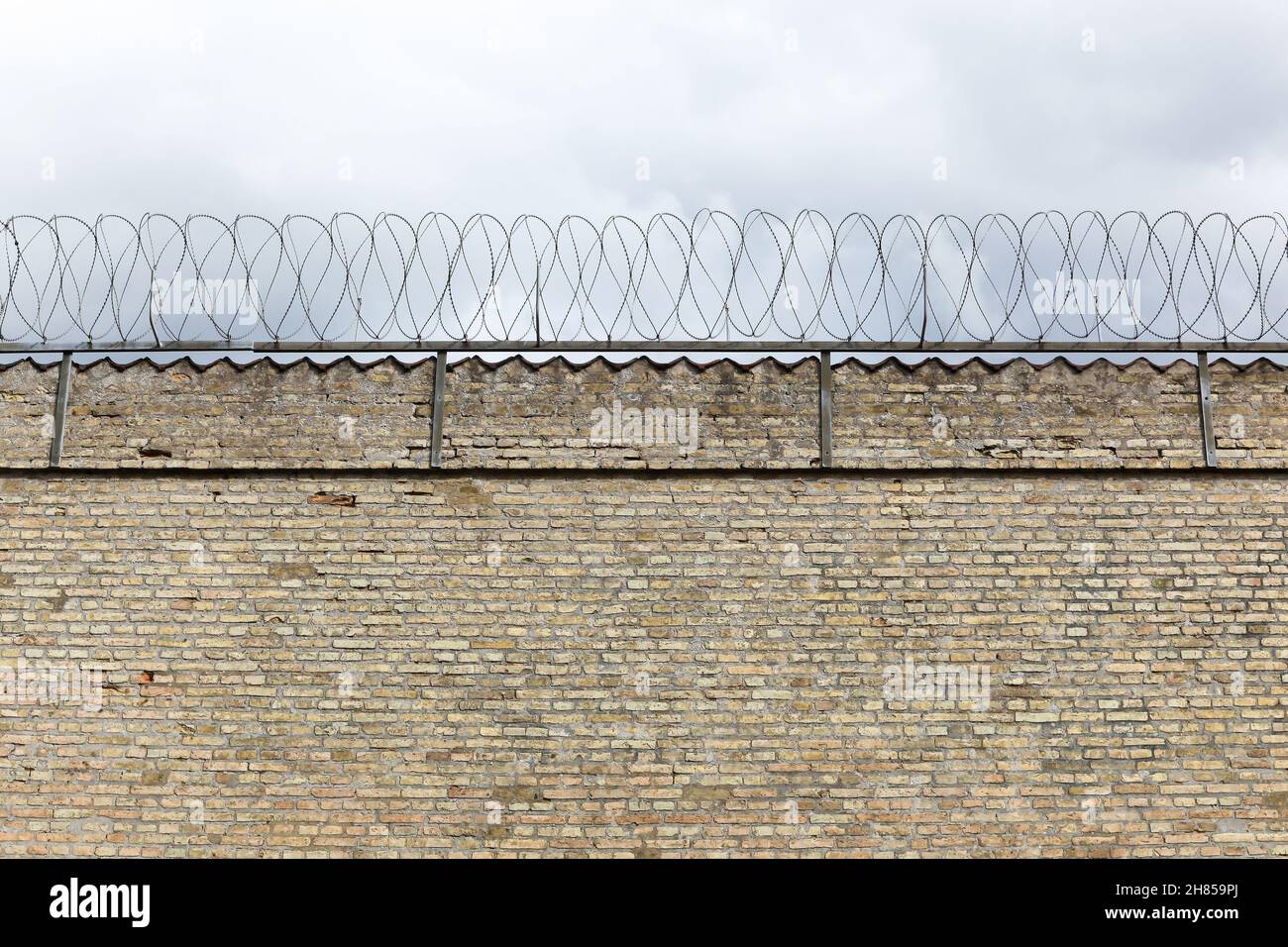Barbed wire wall of a prison in Denmark Stock Photo - Alamy