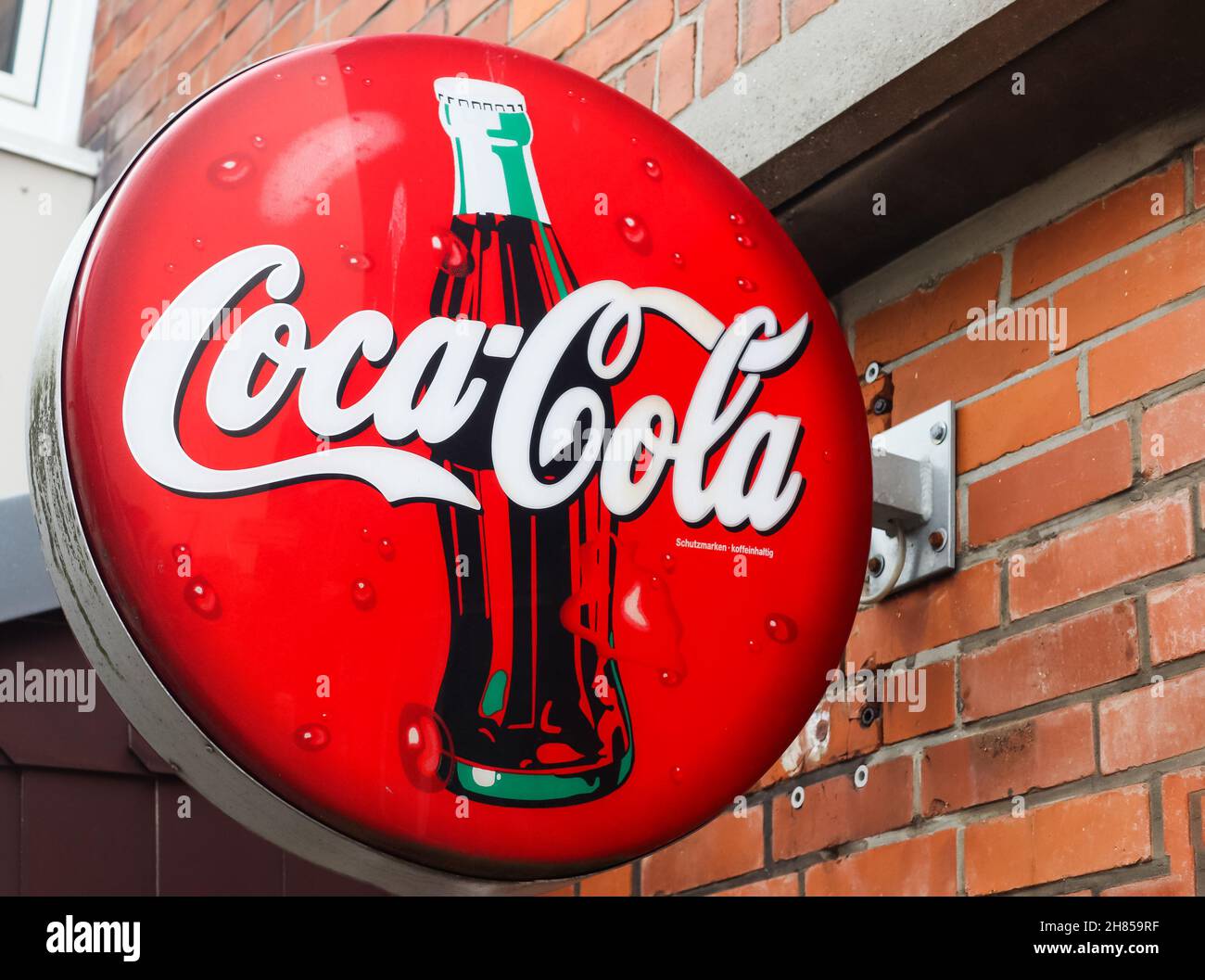 KIEL, GERMANY - Oct 30, 2021: A Coca Cola advertising sign on a red ...