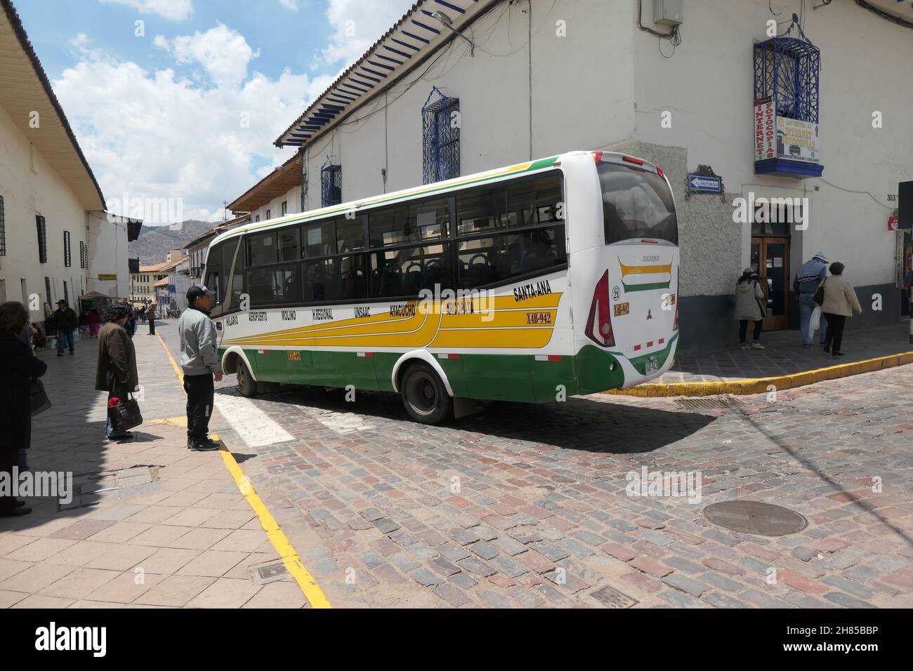 tourist local bus in Cusco Peru South America Andes mountains waiting on street corner Mercedes ...