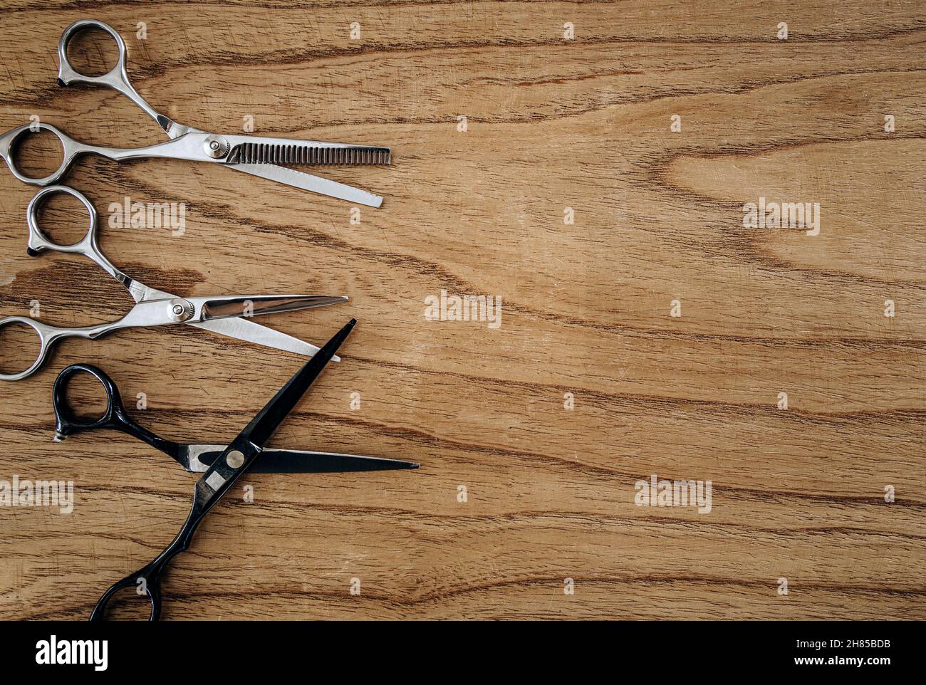 Top view of Barber scissors over wooden table. Barbershop background ...