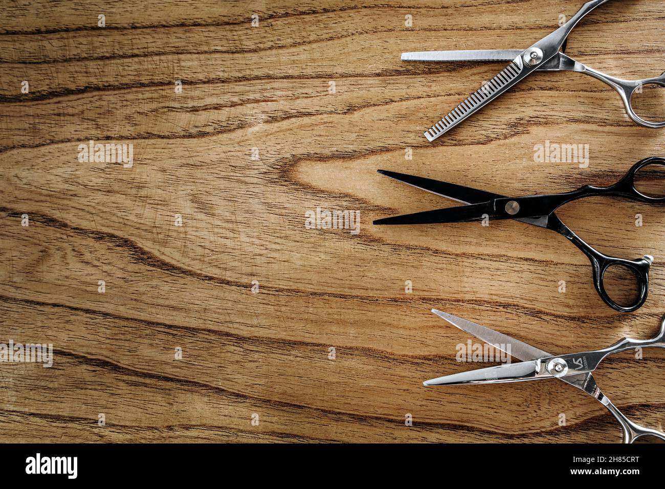 Top view of Barber scissors over wooden table. Barbershop background ...
