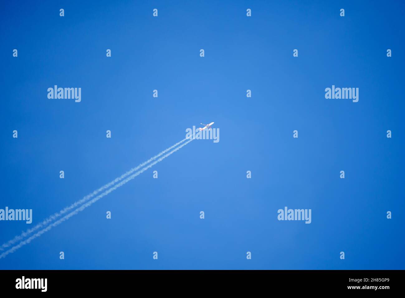 An Easyjet Airbus A320 twin engine jet airliner in deep blue sky with ...
