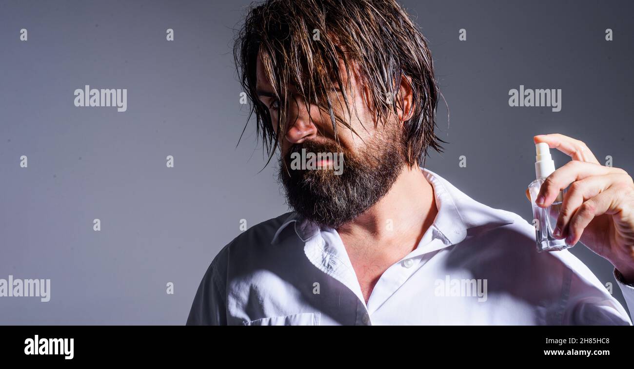 Handsome bearded man with perfume. Cosmetics advertising. Rich man with ...