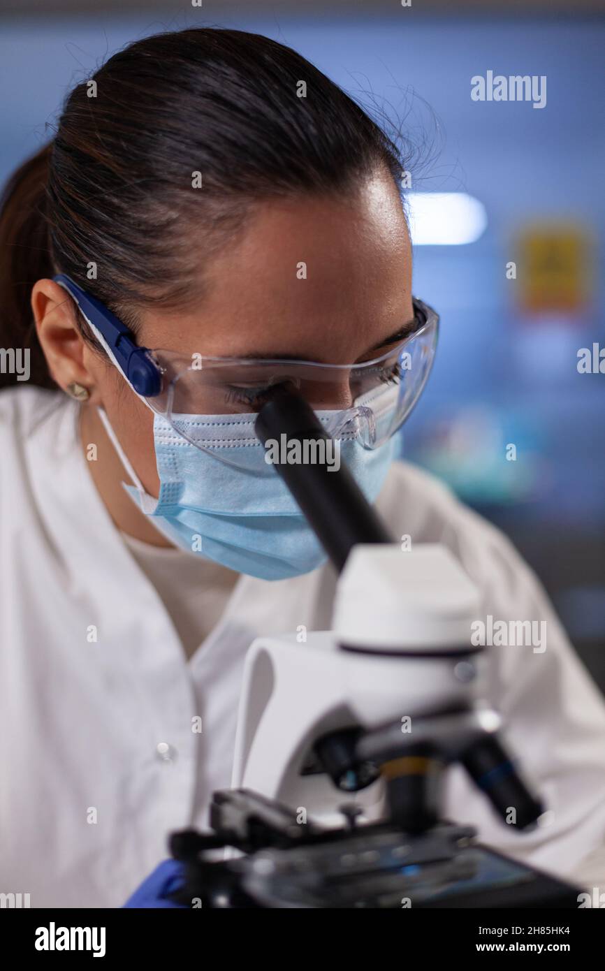 Closeup of chemist researcher analyzing genetic sample using medical ...