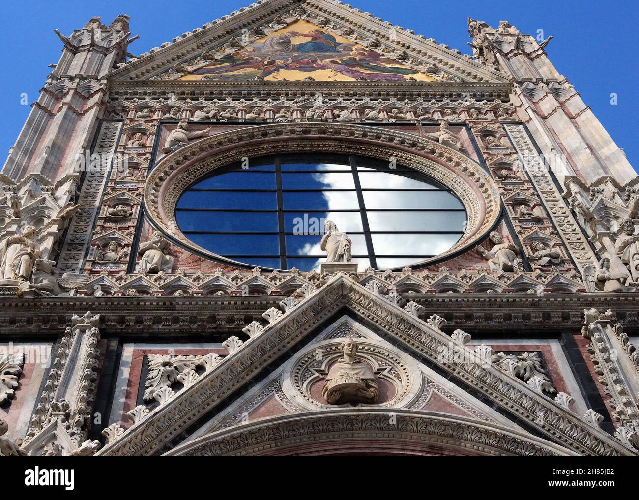 Large Round Window Reflecting The Sky On The Facade Of The Famous ...