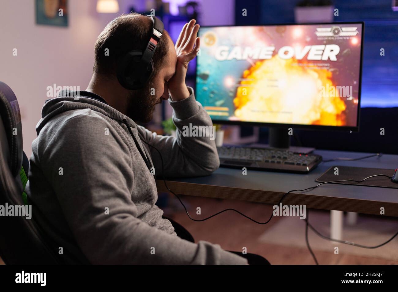 Sad gamer losing video games play on computer. Man playing online games ...