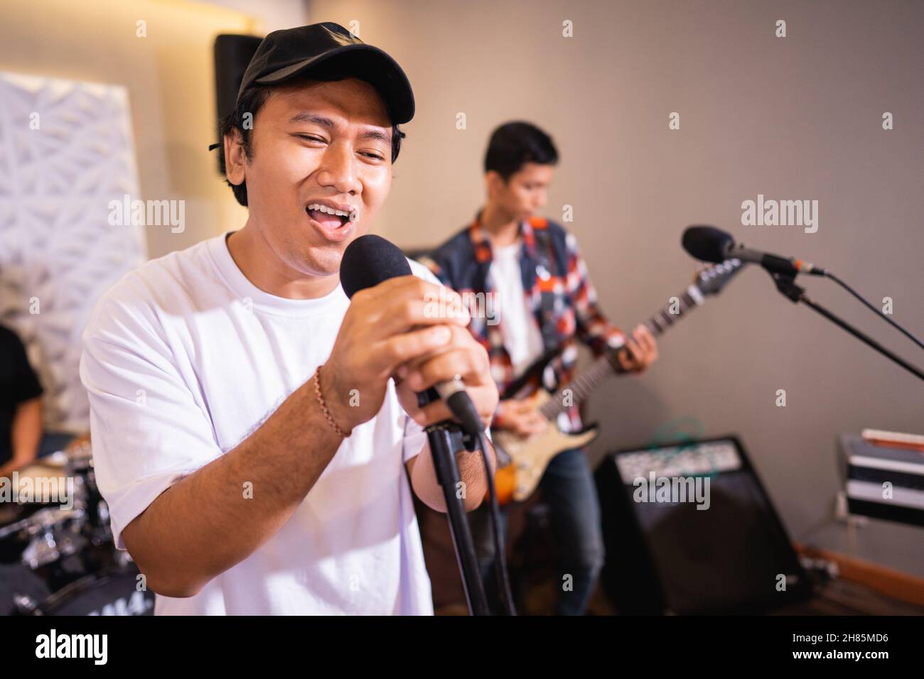 Young asian male musician wearing hi-res stock photography and images ...