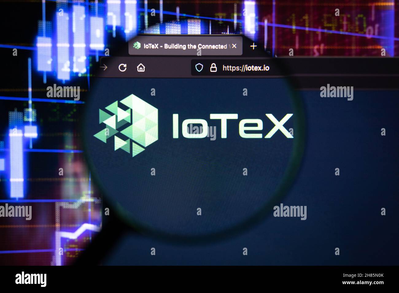 IoTeX company logo on a website, seen on a computer screen through a ...