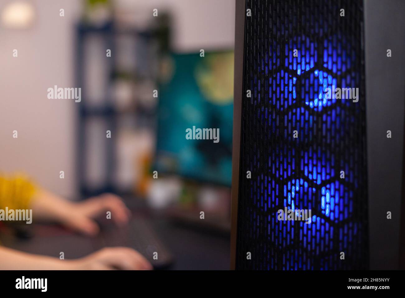 Closeup of RGB led lights powerful computer, woman gamer playing space ...