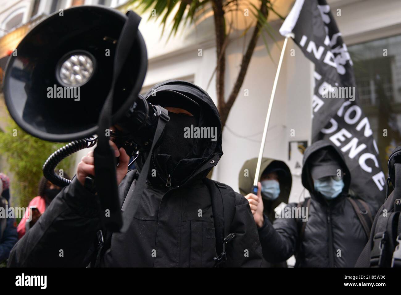 A pro Hong Kong democracy and anti CCP protester shouts slogans on a ...