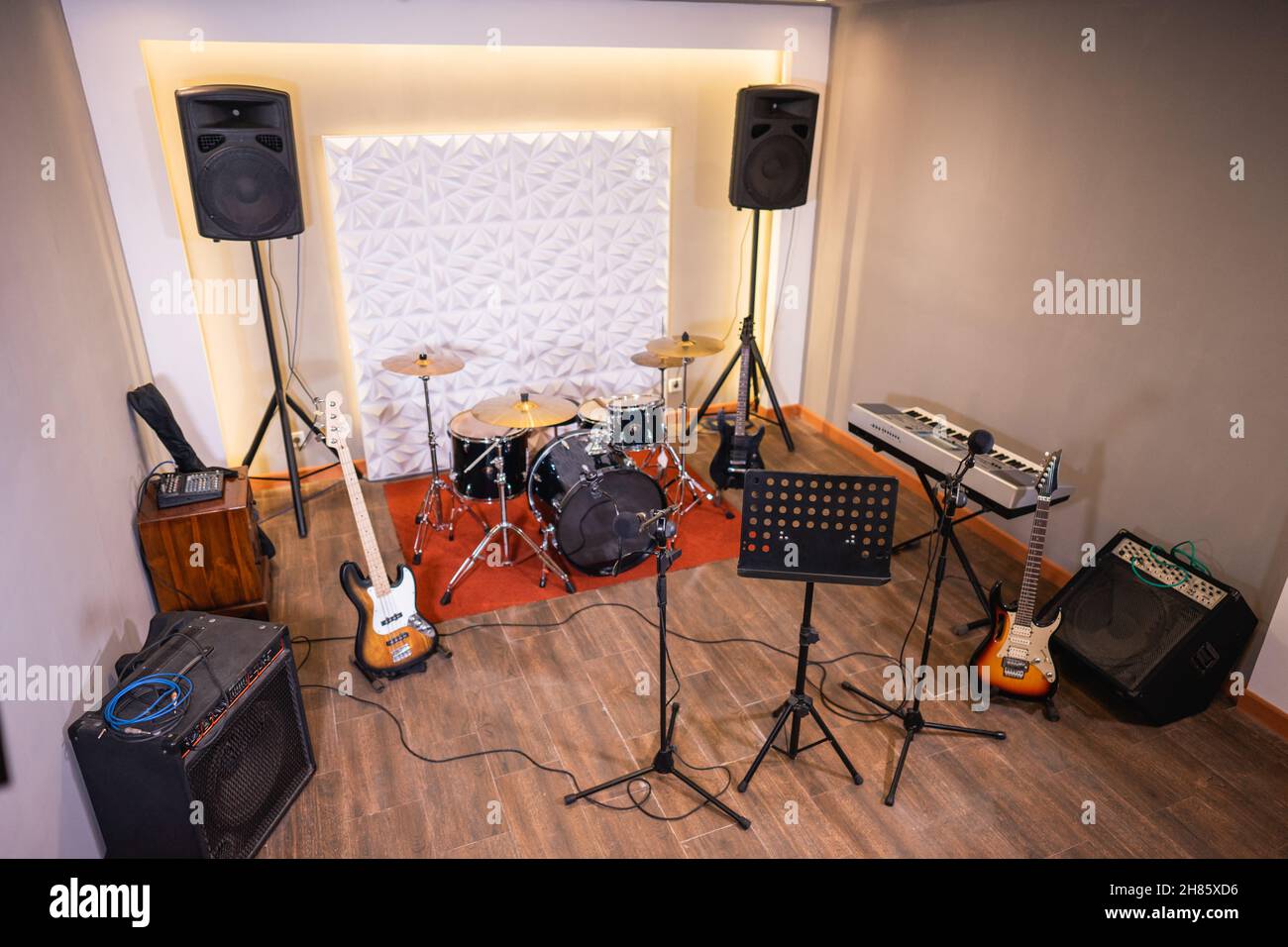 music room with drum set and guitar, bass and sound system Stock Photo ...