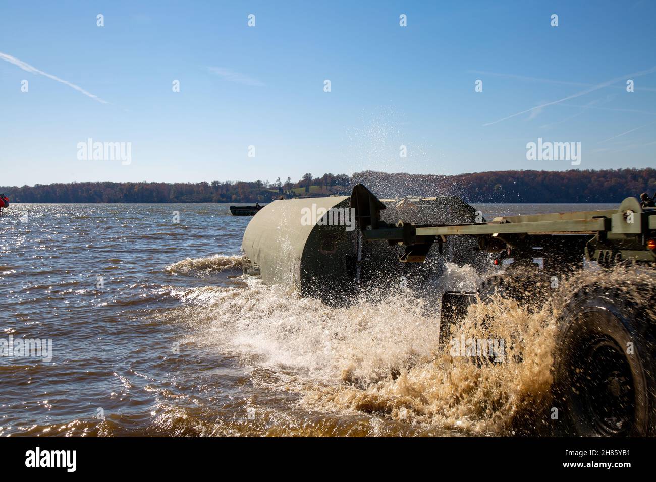 A bridge bay splashes into the water during an improved ribbon bridge ...