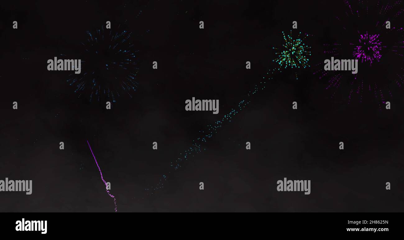 Image of green and pink fireworks exploding on black background Stock ...