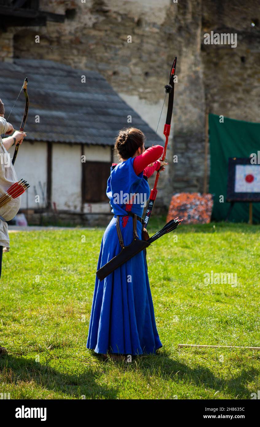 Medieval archers with bows on the territory of the castle Stock Photo ...