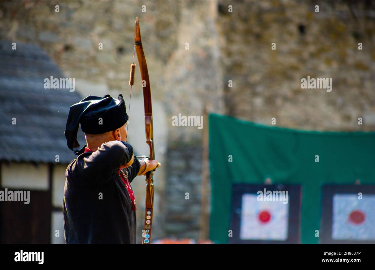 Medieval archers with bows on the territory of the castle Stock Photo ...