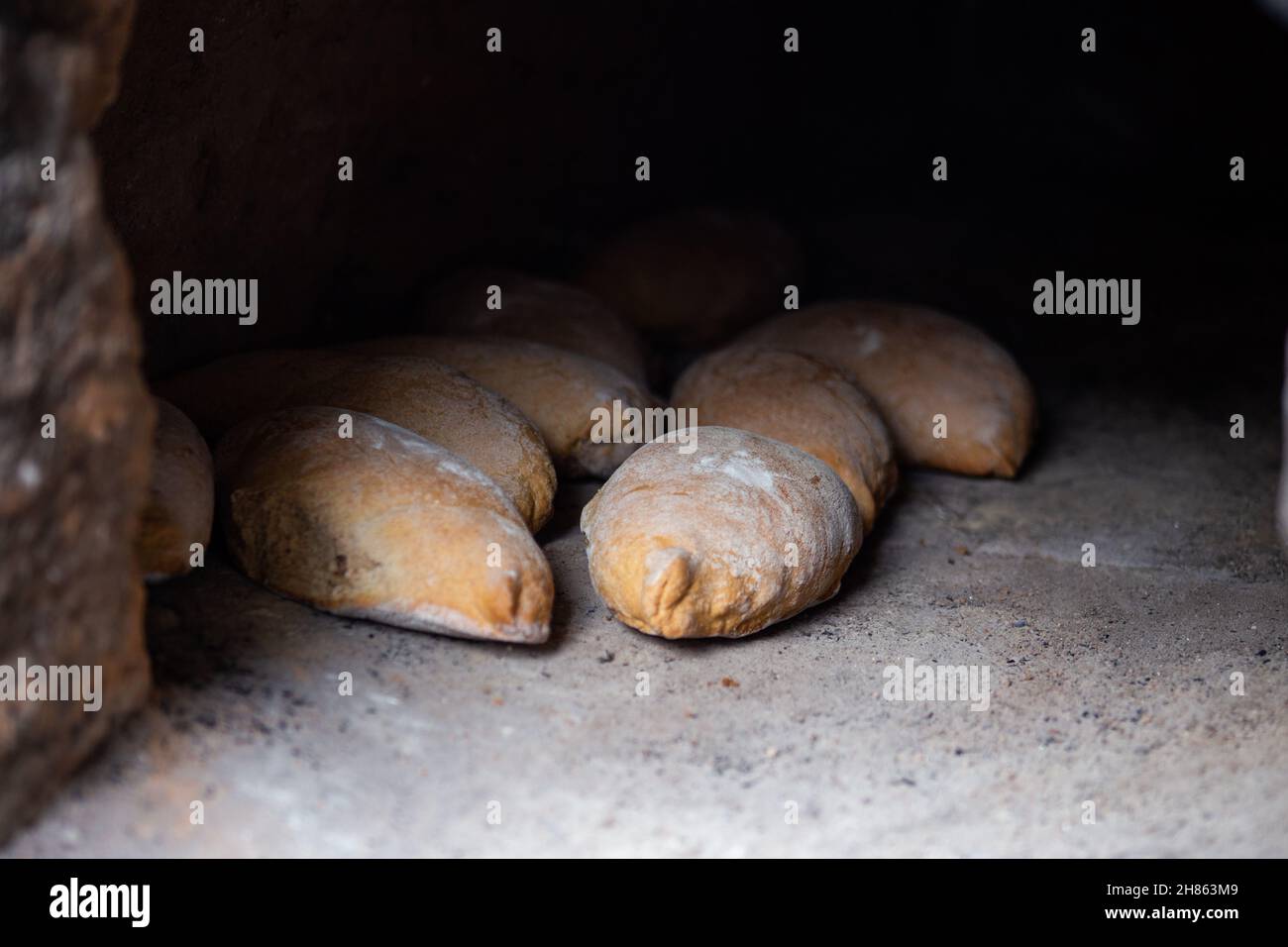 Natural bread cooked in an old oven on a stone Stock Photo - Alamy