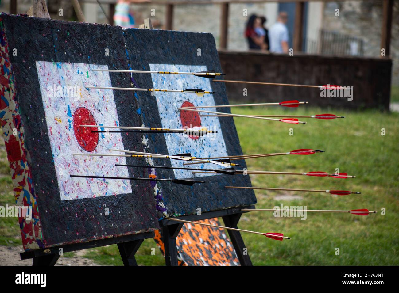 Many medieval arrows hit the target Stock Photo - Alamy