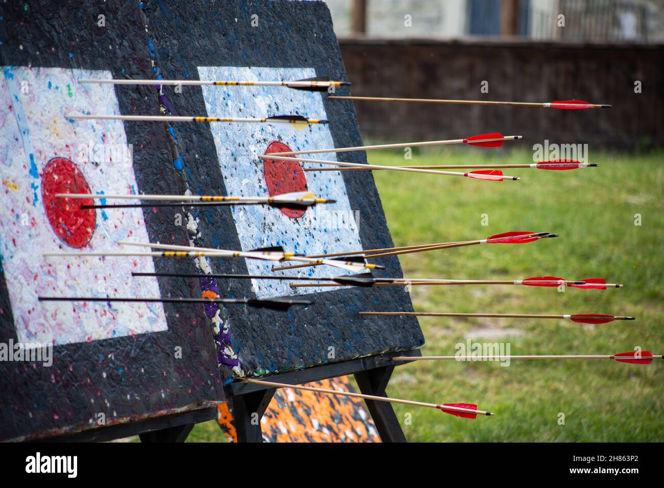 Many medieval arrows hit the target Stock Photo - Alamy