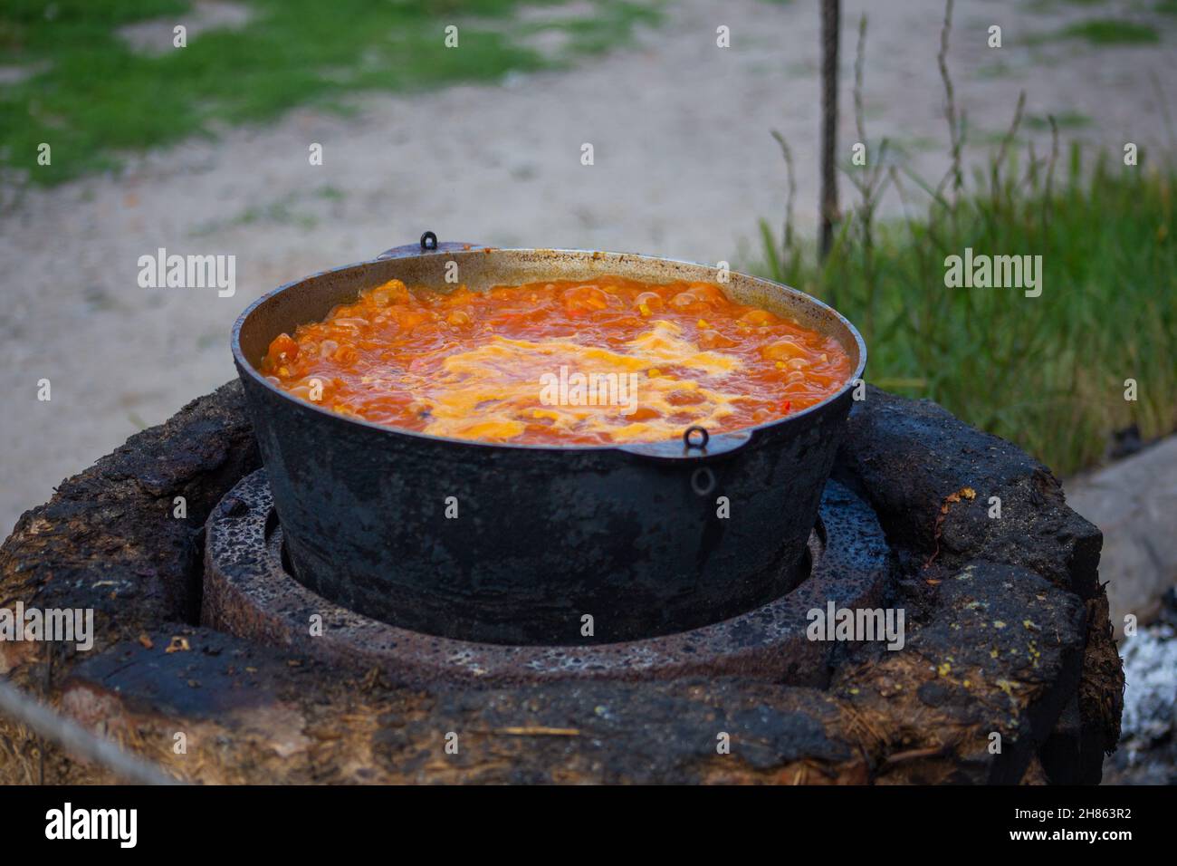 Large cauldron with a fluffy soup on the street Stock Photo - Alamy
