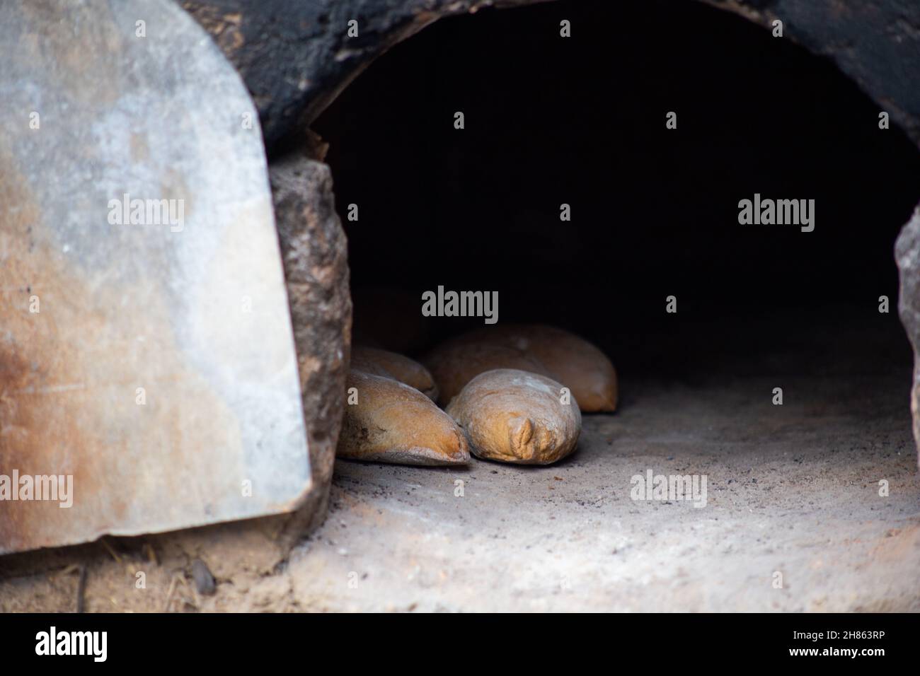 Natural bread cooked in an old oven on a stone Stock Photo - Alamy