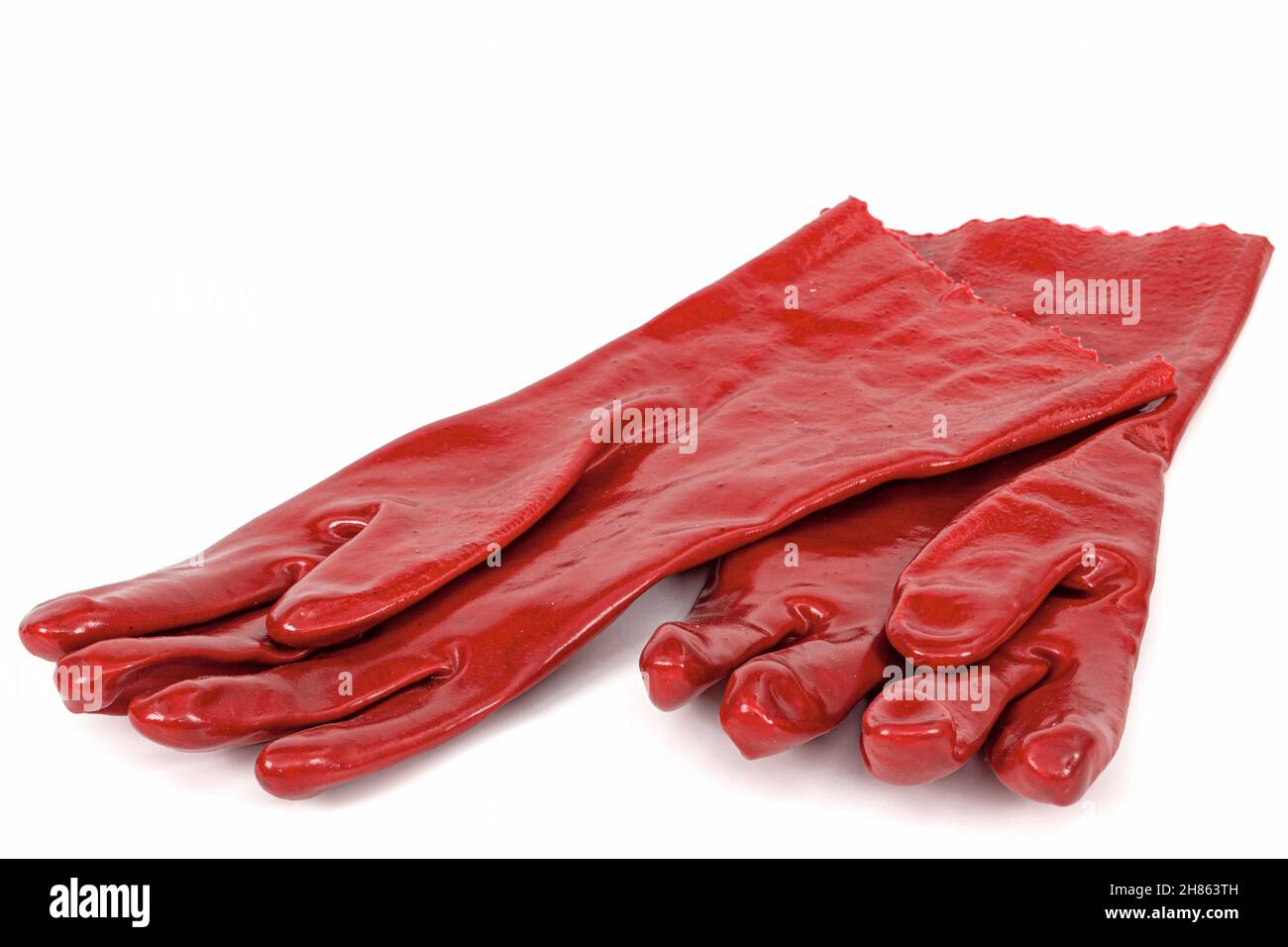 Pair of the red rubber gloves, isolated on white background Stock Photo ...