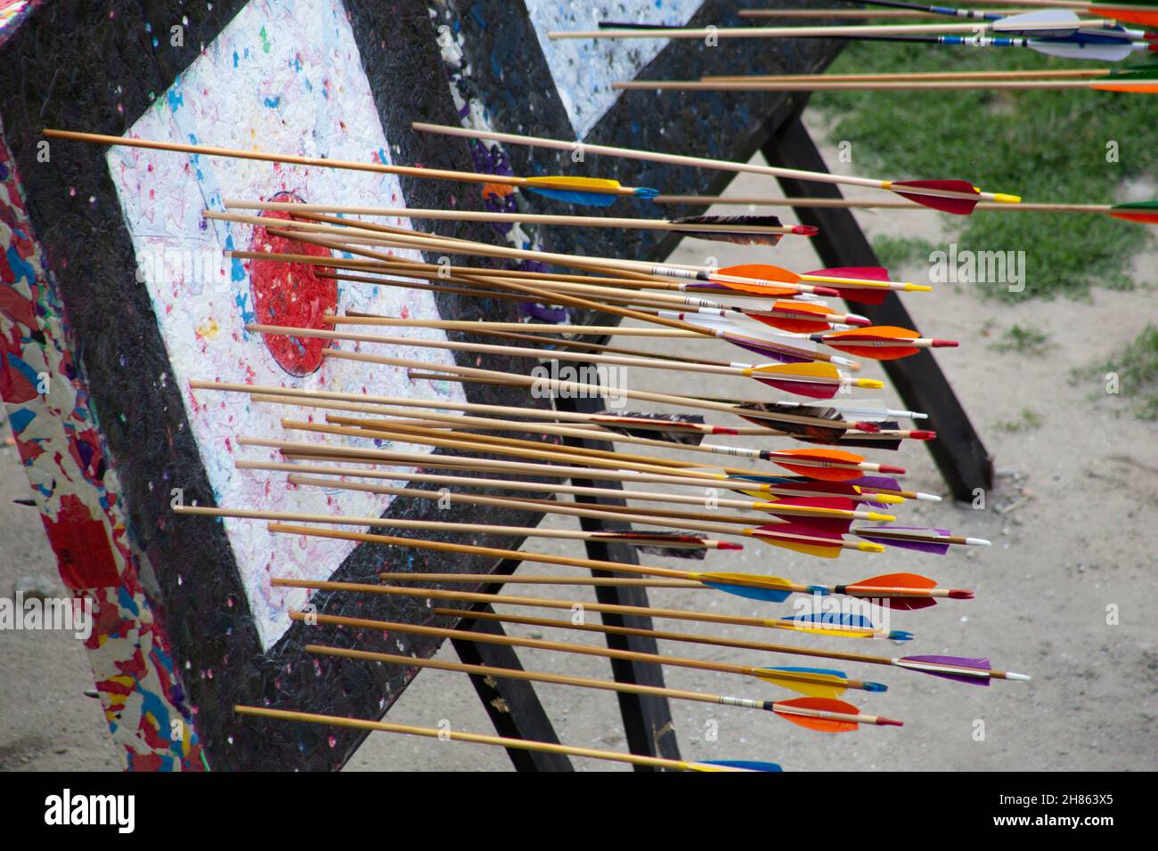 Many medieval arrows hit the target Stock Photo - Alamy