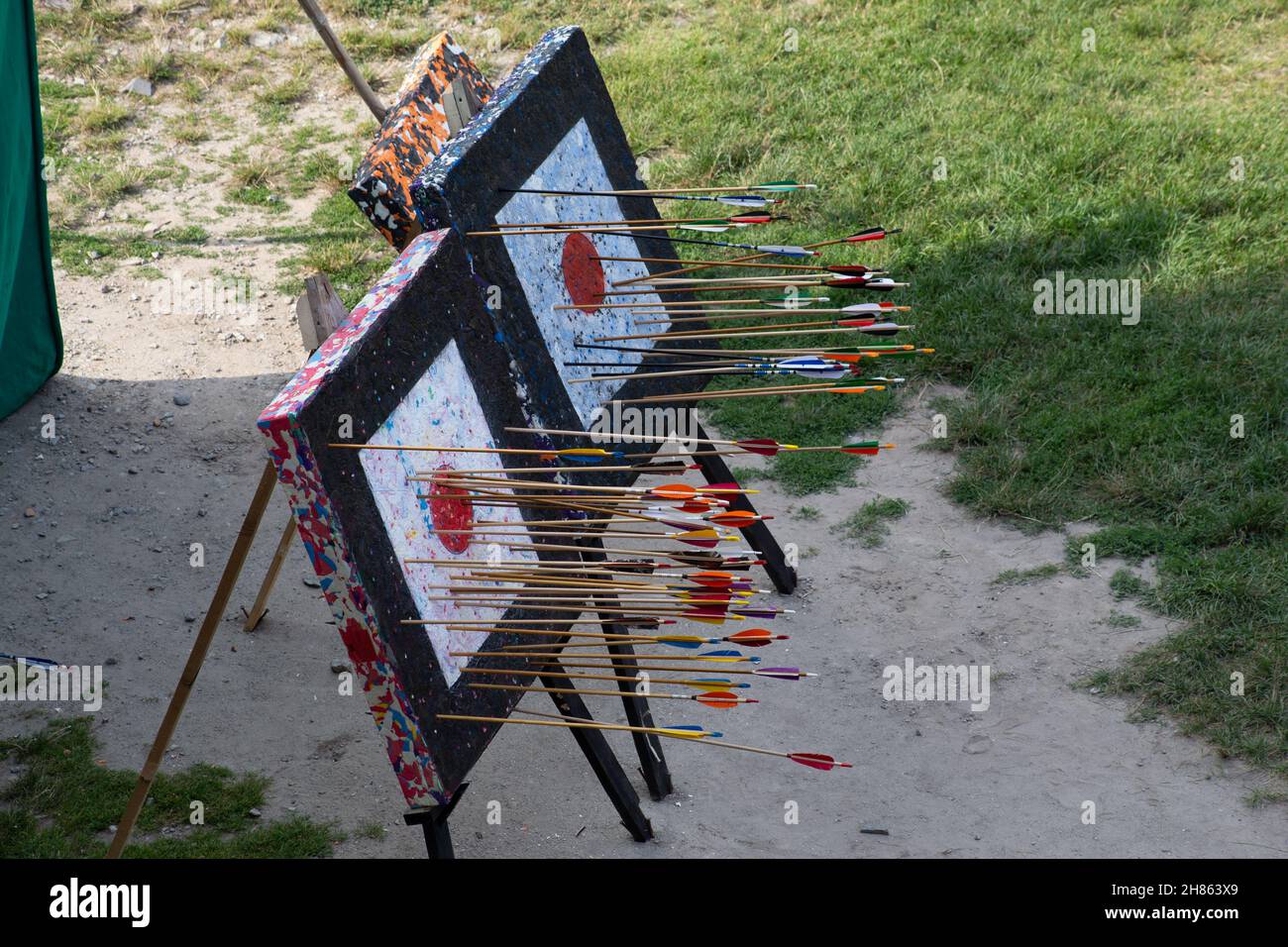 Many medieval arrows hit the target Stock Photo - Alamy